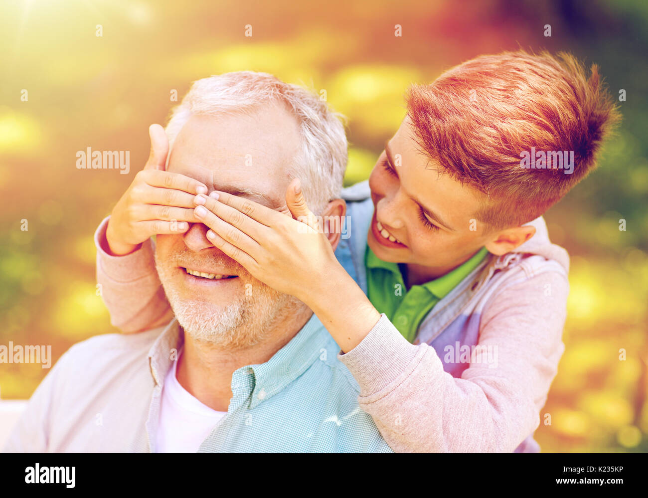 grandfather and grandson playing at summer park Stock Photo - Alamy
