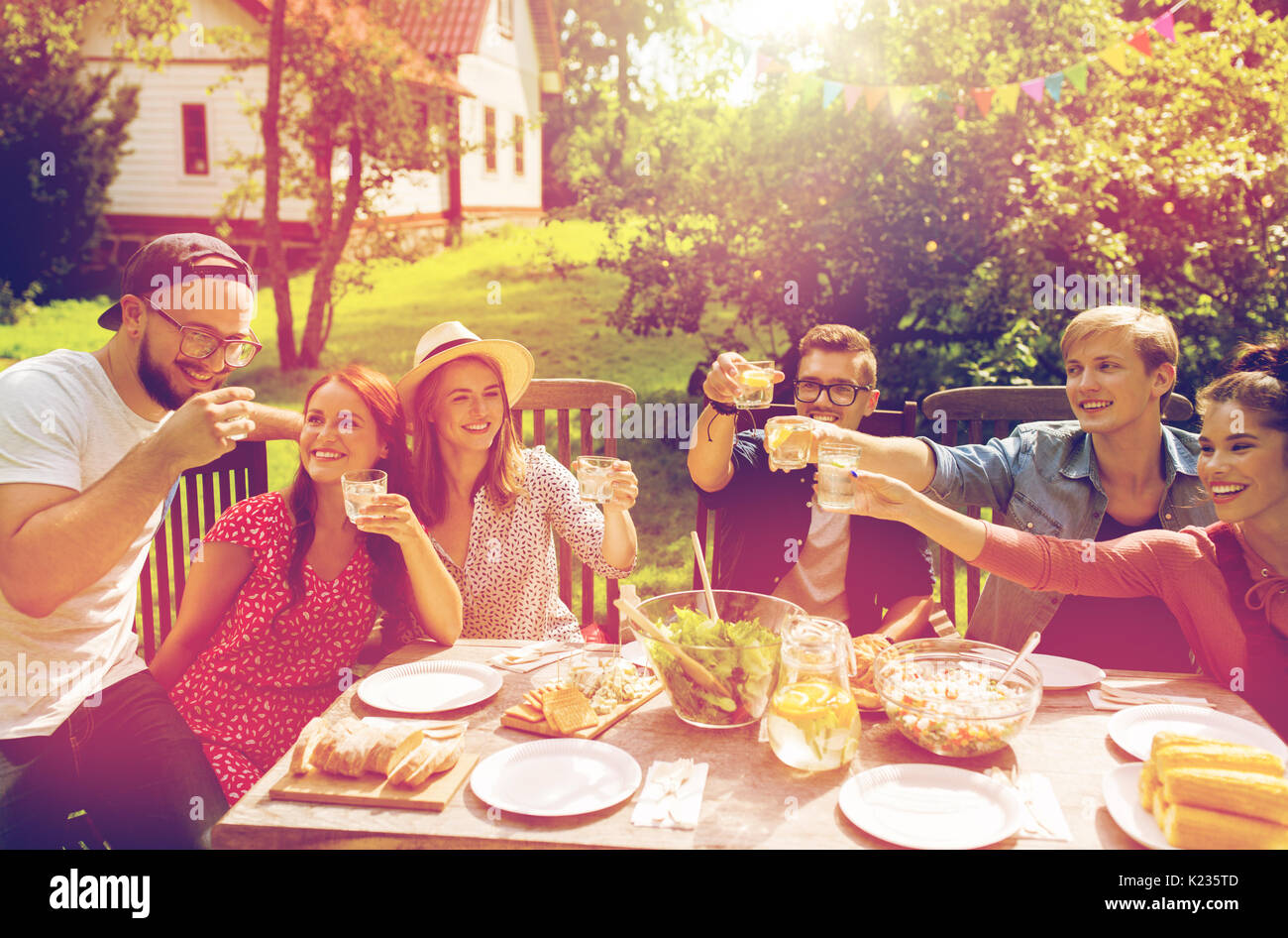 happy friends having party at summer garden Stock Photo - Alamy