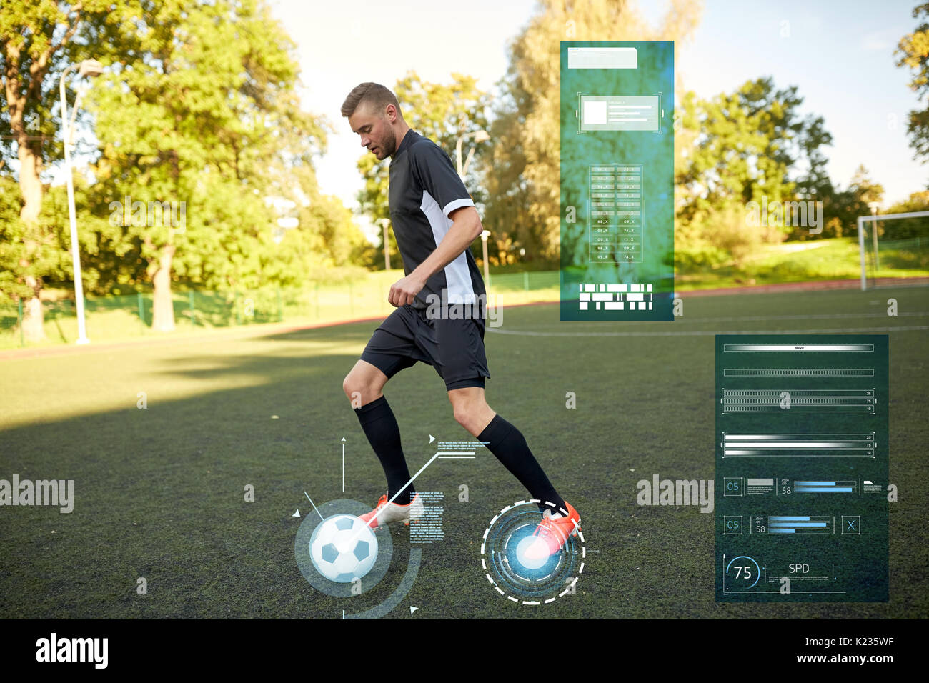 soccer player playing with ball on football field Stock Photo - Alamy