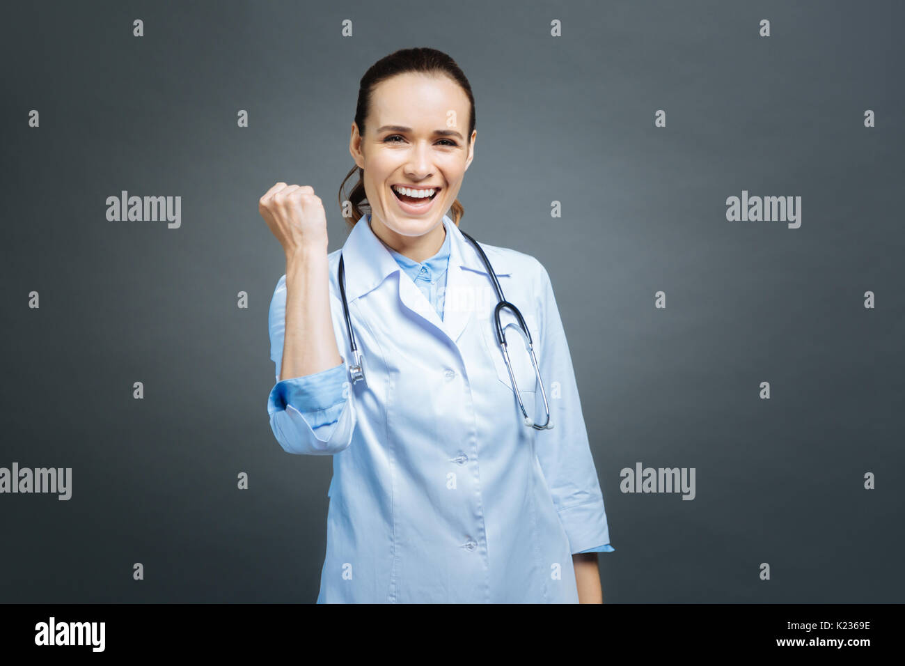 Excited female doctor getting excited into camera Stock Photo - Alamy