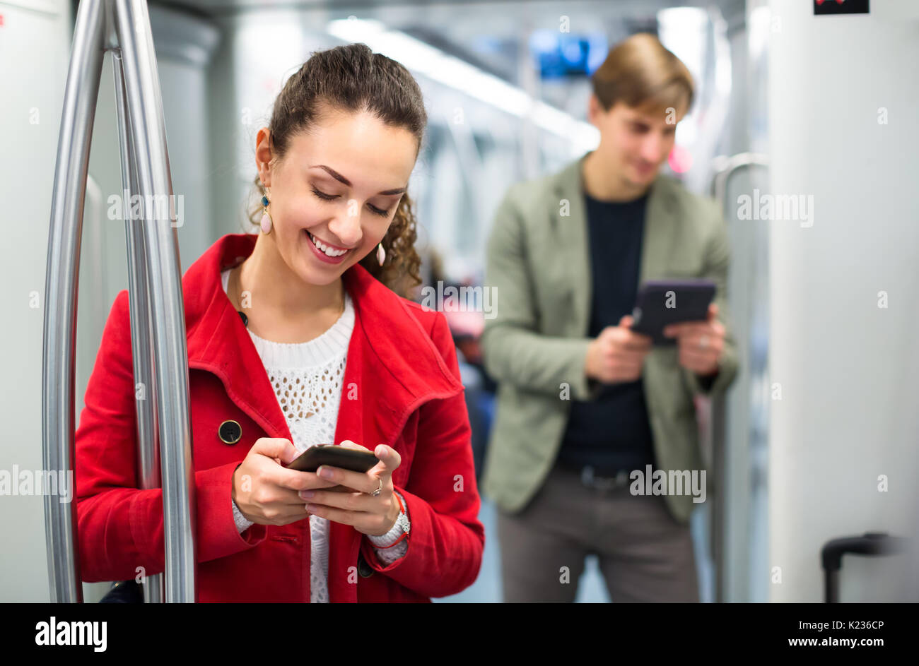 Young subway passengers busy with a modern phones and tablet Stock ...