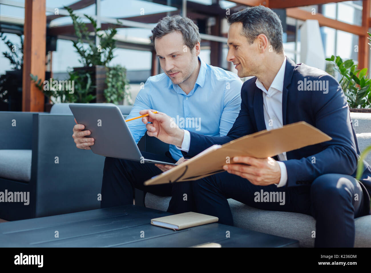 Cheerful smart entrepreneur explaining his ideas Stock Photo - Alamy