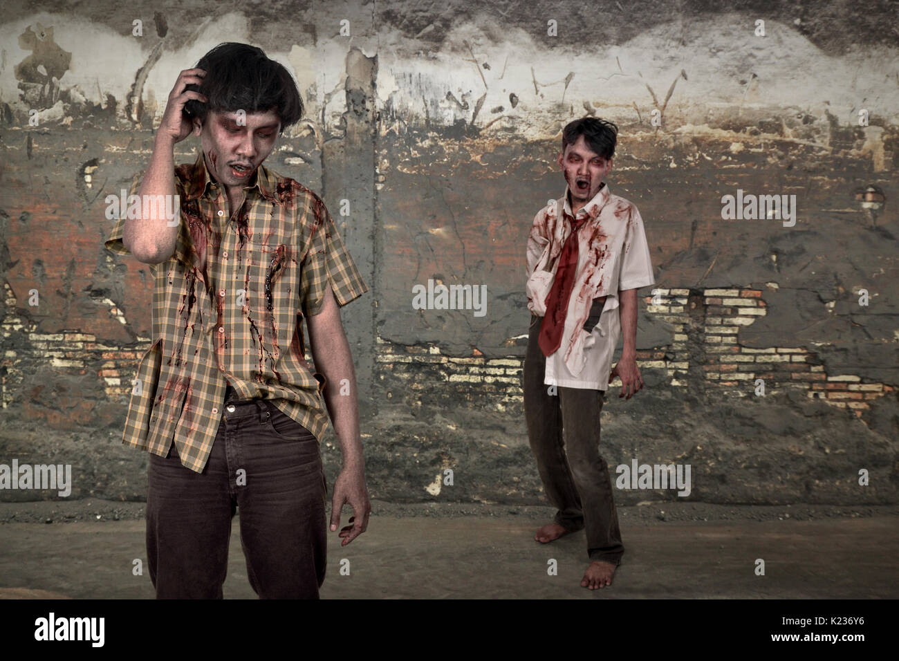 Horrible two asian zombies with blood standing on the old house Stock ...