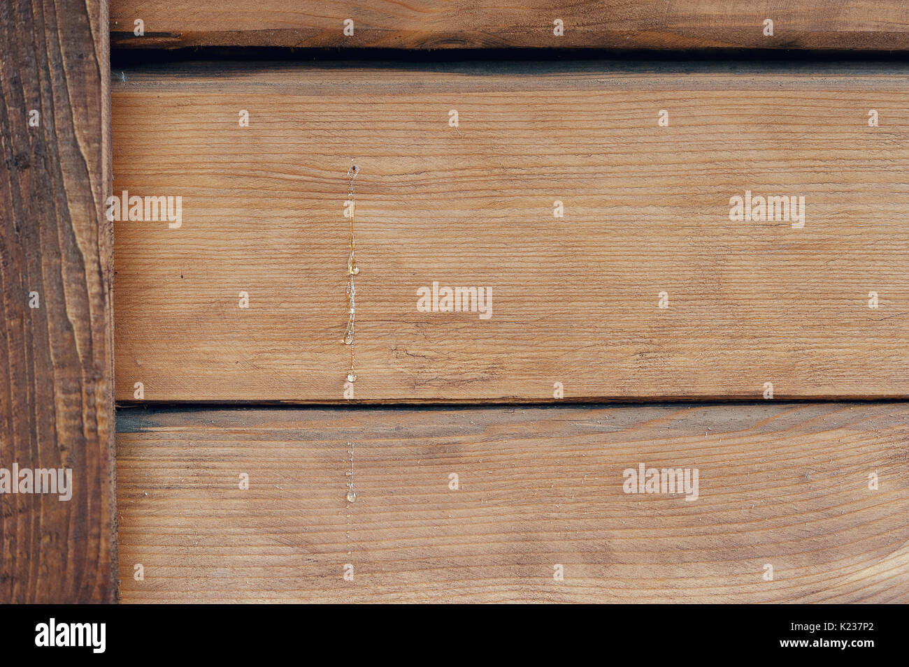 Texture of wood with flowable resin on the wall of a house made of wood ...