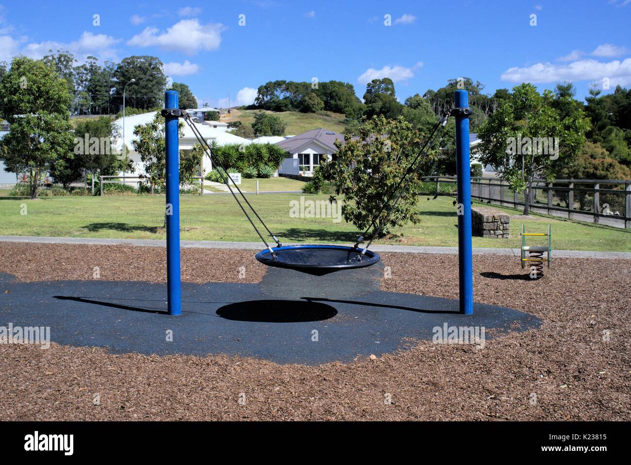 Round swing in kids park Stock Photo - Alamy