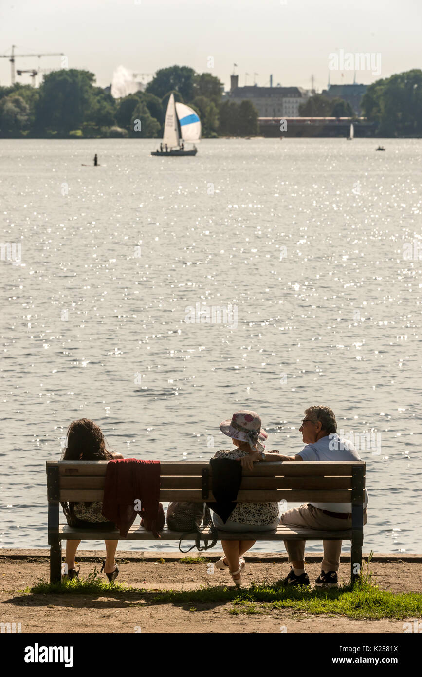 Sitting at the lakeside in Hamburg, Germany Stock Photo - Alamy