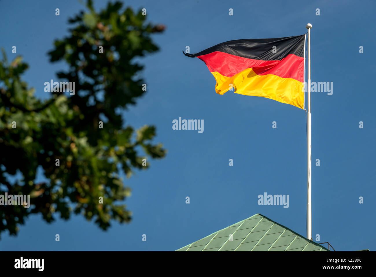 German flag flying hi-res stock photography and images - Alamy