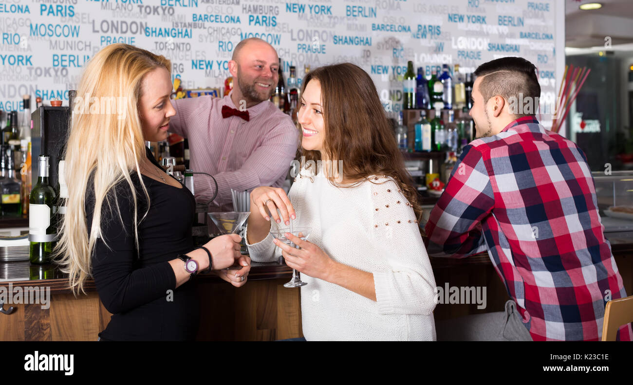 Cheerful bartender pouring cocktails party hi-res stock photography and ...