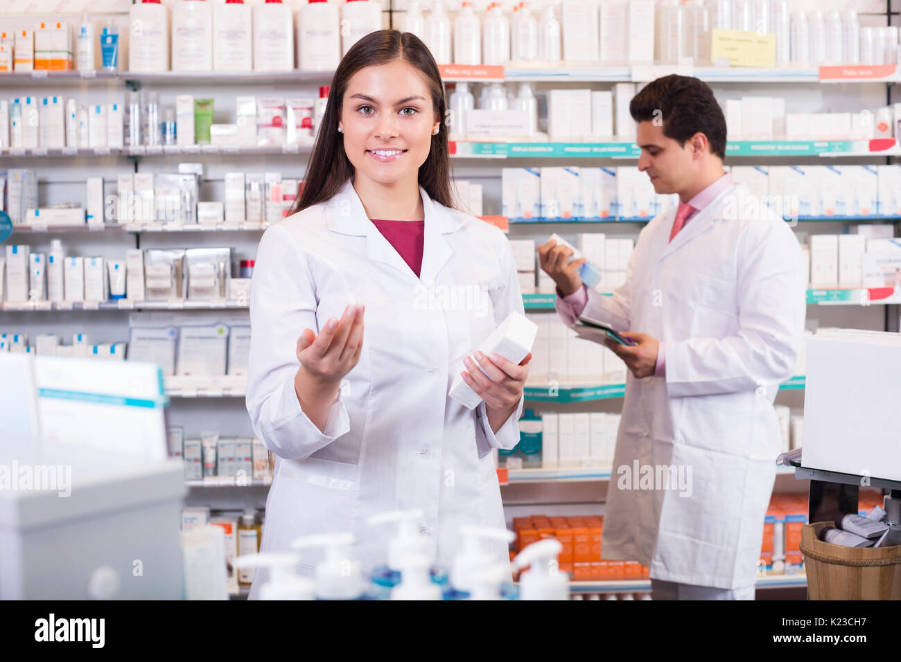 Happy pharmacist and pharmacy technician working in drugstore Stock ...