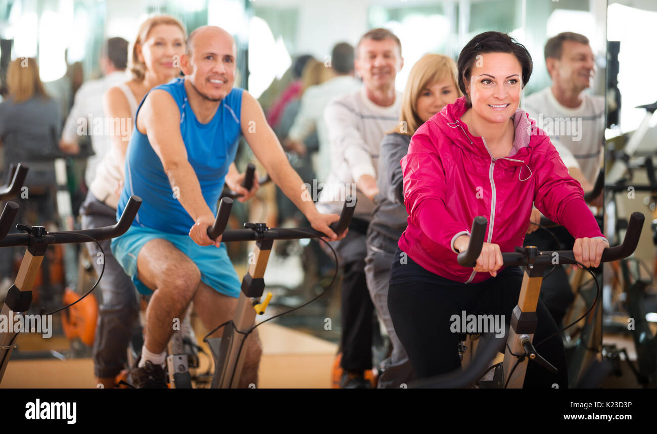 Group of people cycling in a gym Stock Photo - Alamy