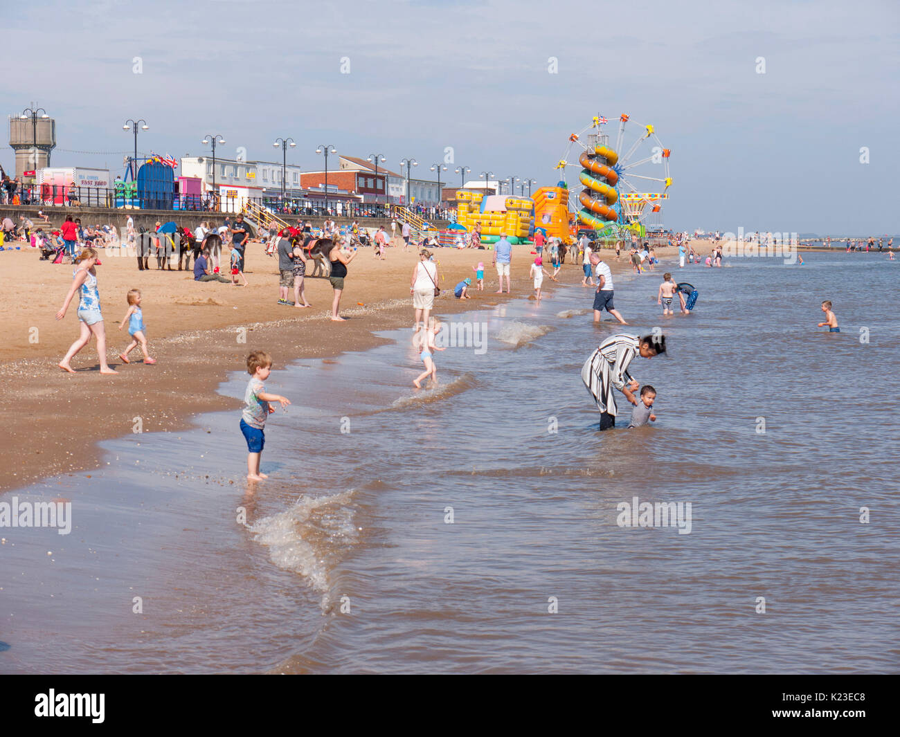 People enjoy sunny weather on beach hi-res stock photography and images ...