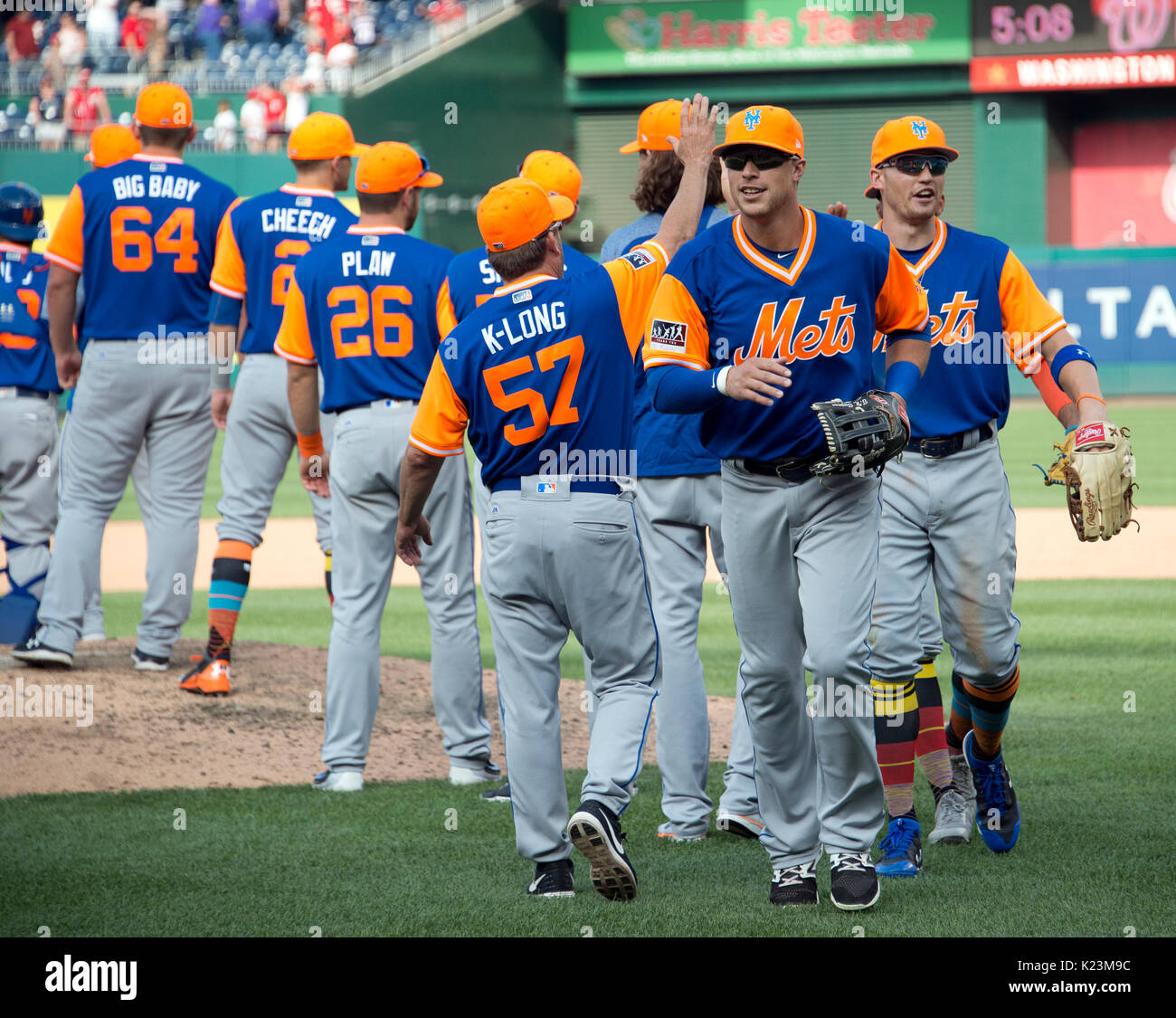 The New York Mets celebrate their victory in the first game of a double ...