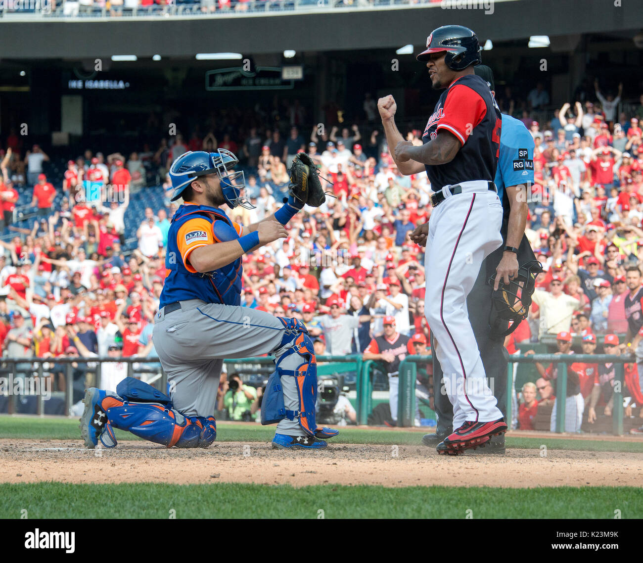 New York Mets catcher Travis d'Arnaud (18) shows home plate umpire Andy ...
