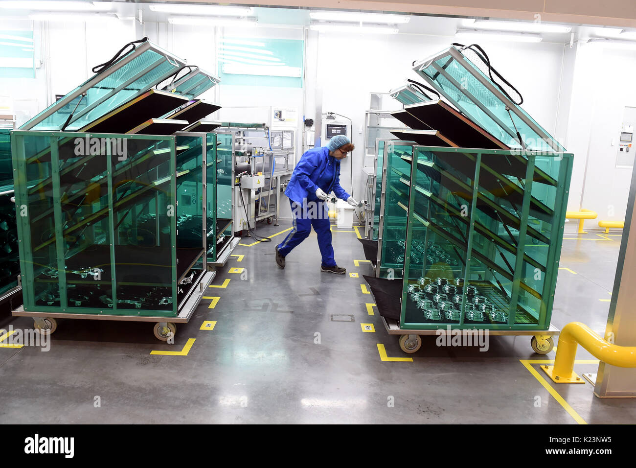 Employee works in Hyundai Mobis's new headlight production plant in ...