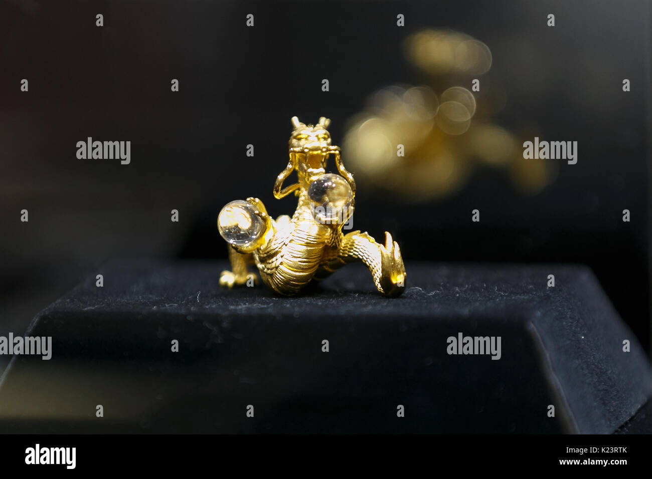 A pure gold dragon valued at 950,400 JPY on display during the Japan ...