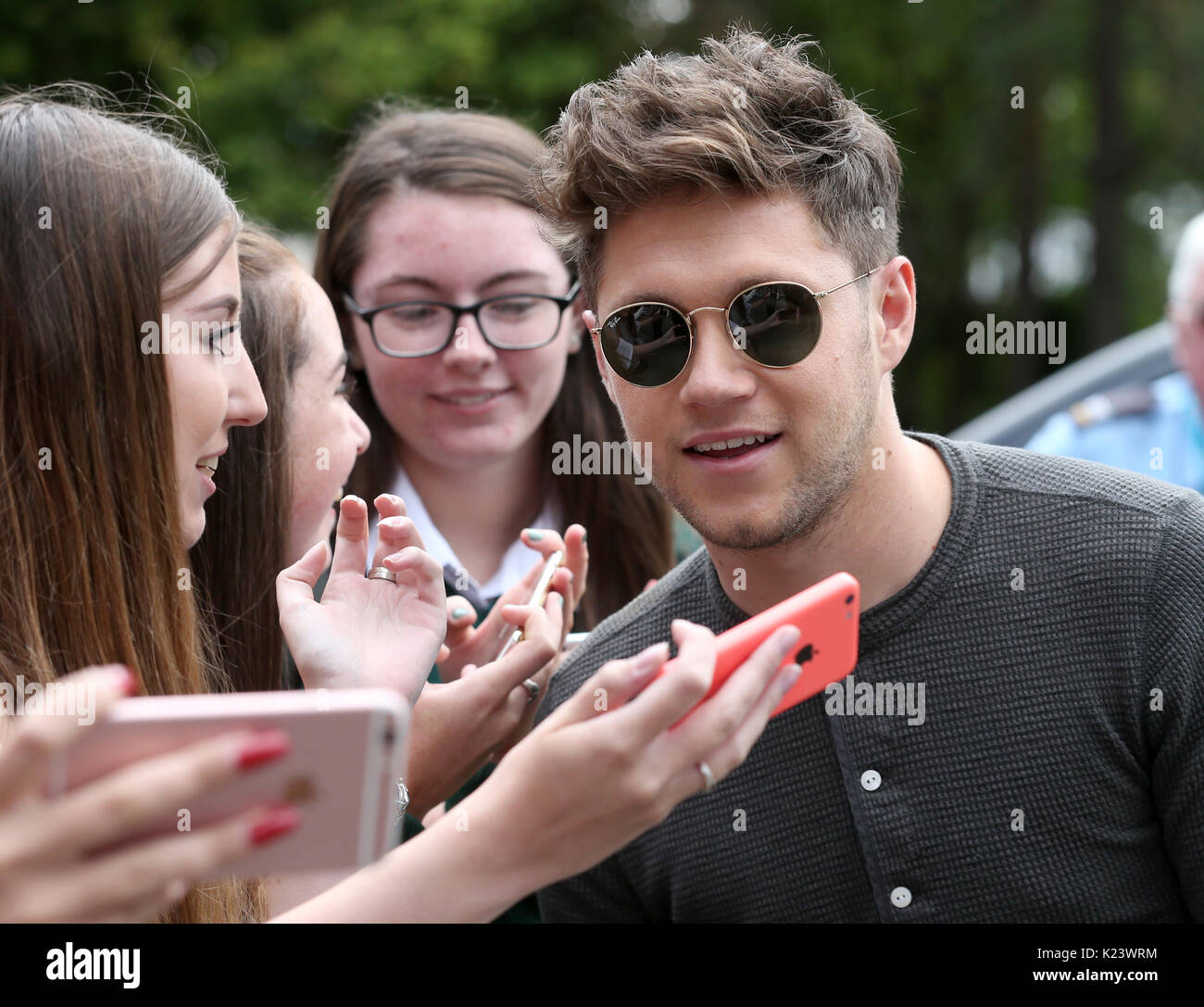 Dublin, Ireland. 30th August 2017. Niall Horan stops to take selfies ...