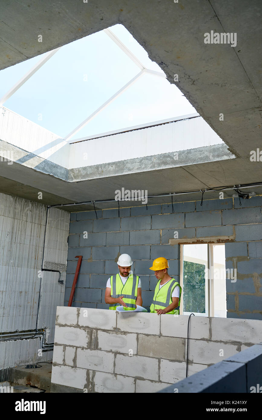 Construction Workers on Site Stock Photo - Alamy