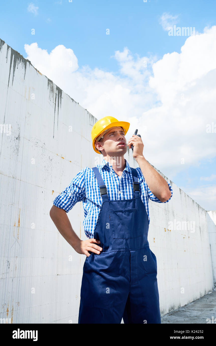 Construction Foreman Using Portable Radio Stock Photo - Alamy