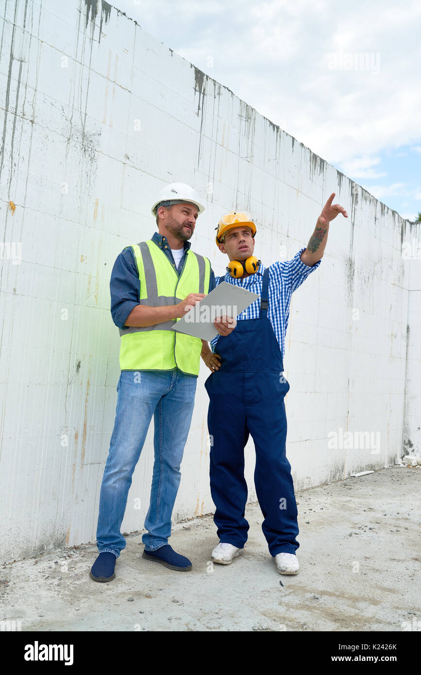 Workers Planning Construction Stock Photo - Alamy