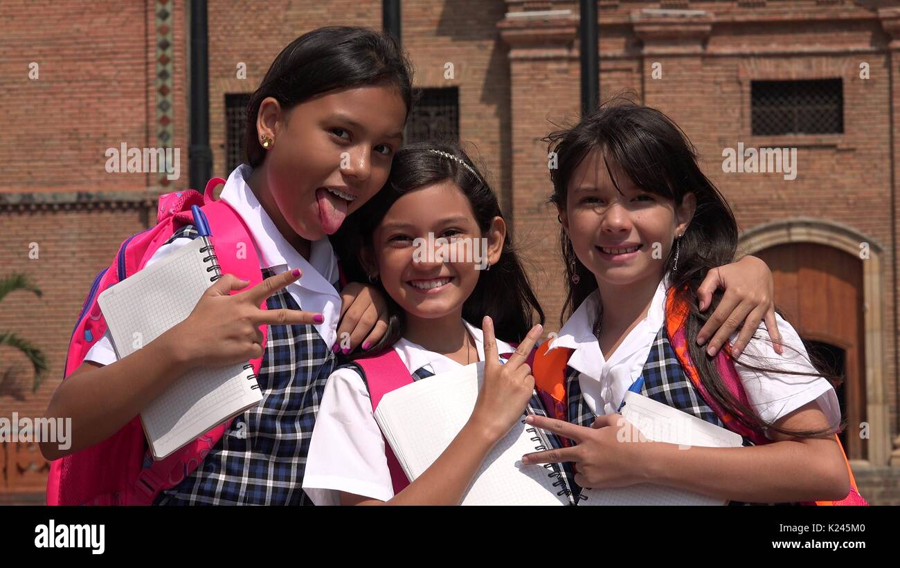 Young Girl Students And Peace Sign Wearing School Uniforms Stock Photo ...