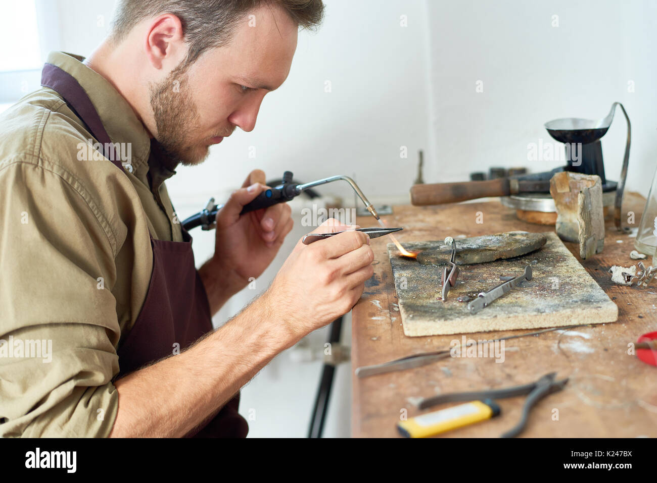 Man Melting Metal Stock Photo - Alamy