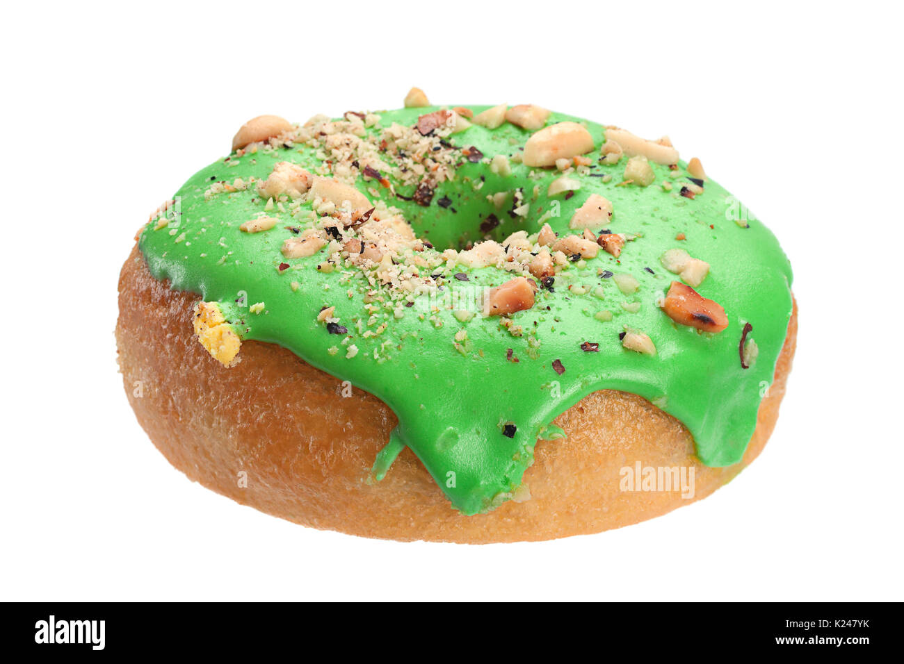 Green donut with nut isolated on white background Stock Photo - Alamy