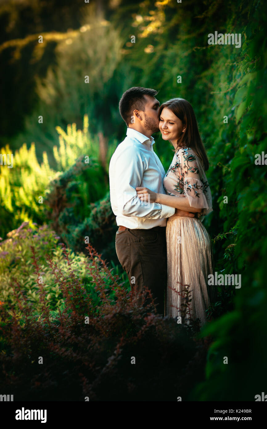 Beautiful young couple on a nature background Stock Photo - Alamy