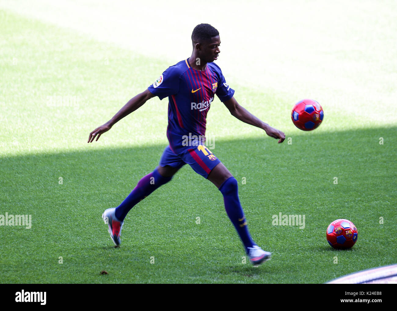 FC Barcelona's new signing Ousmane Dembele gestures during his official ...