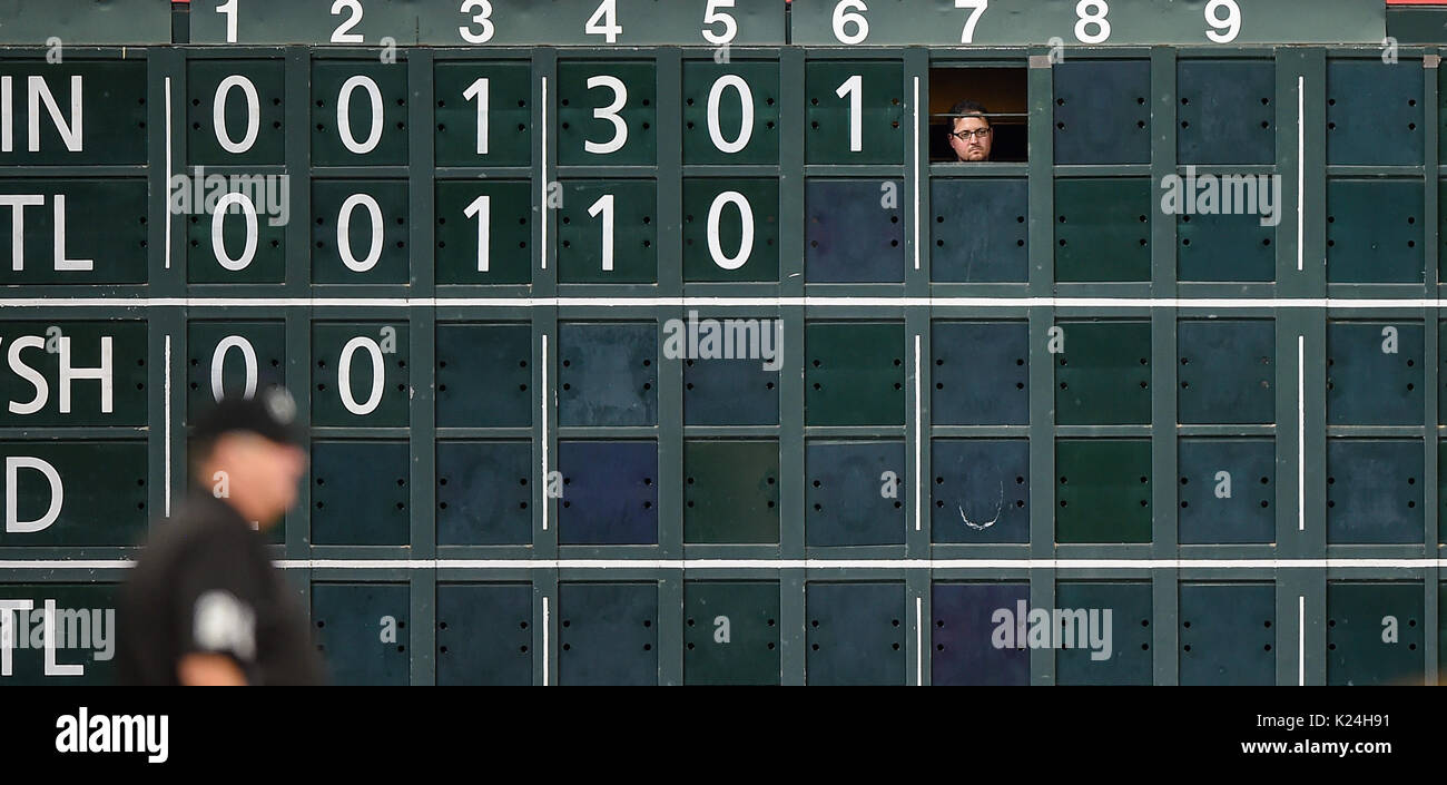 August 19, 2017: A score board operator looks out over the field during ...