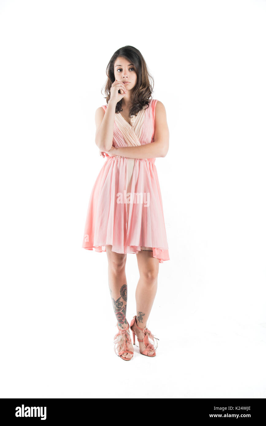 Studio full body portrait of a young woman in pink dress Stock Photo ...