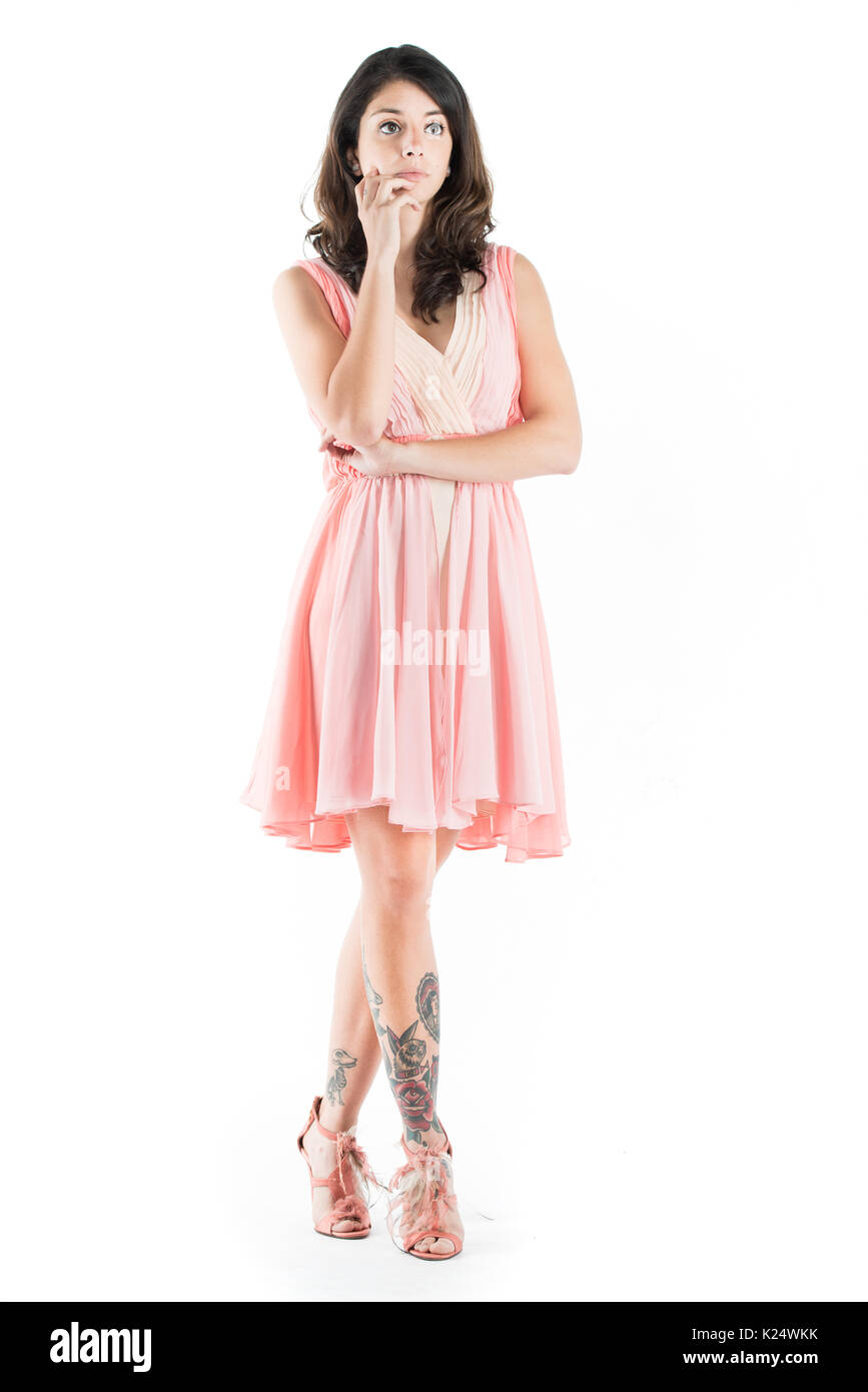Studio full body portrait of a young woman in pink dress Stock Photo ...
