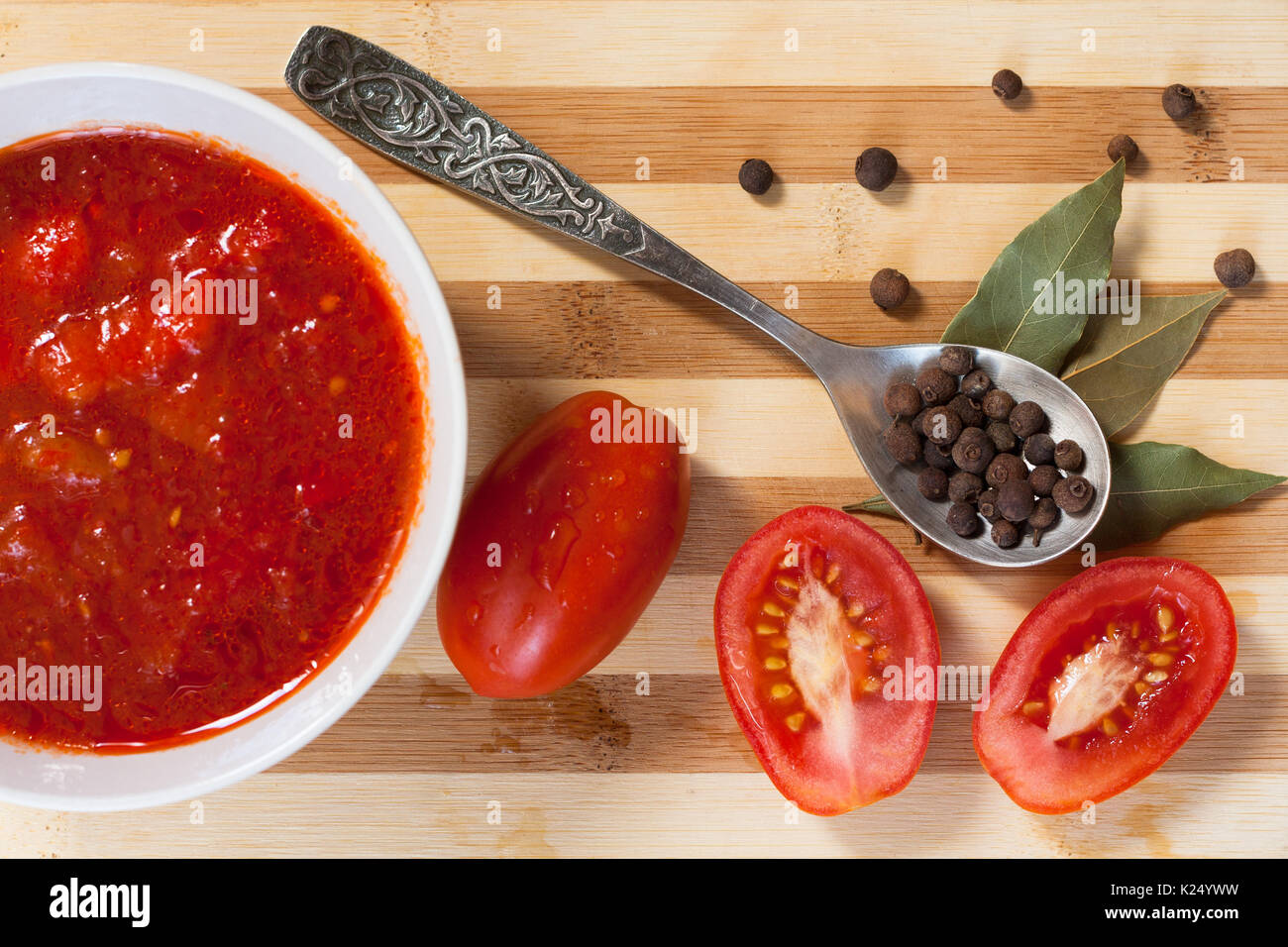 Spoon with tomato hi-res stock photography and images - Alamy