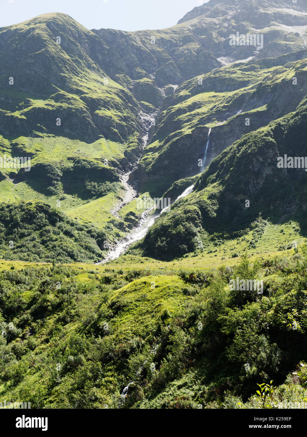 Mountain waterfall in Alps. Scenic Alpine rocky alpine mountines of ...
