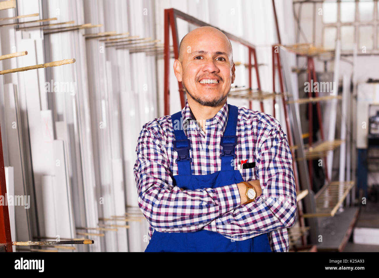 Male middle age labour working in PVC shop and smiling Stock Photo - Alamy