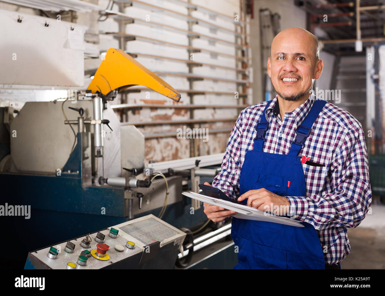 middle age workman at professional lathe in plant Stock Photo - Alamy