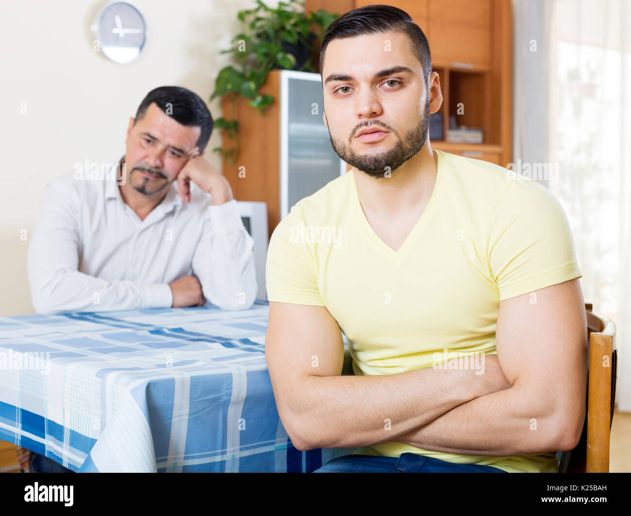 Domestic quarrel between mature father and son Stock Photo - Alamy