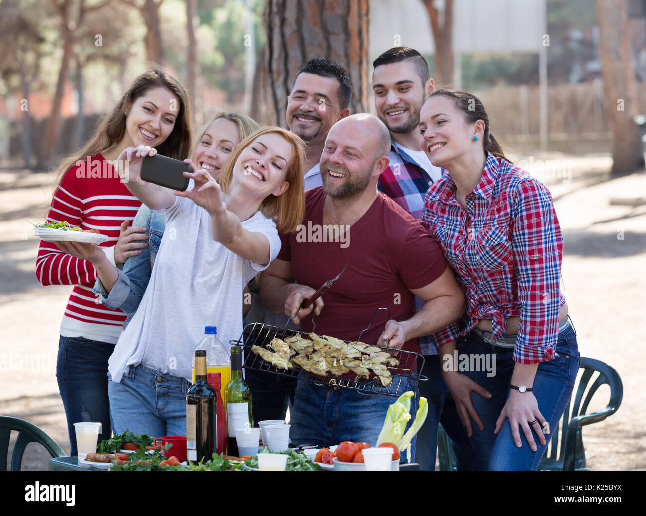 Happy adults relaxing at picnic and doing the selfie Stock Photo - Alamy