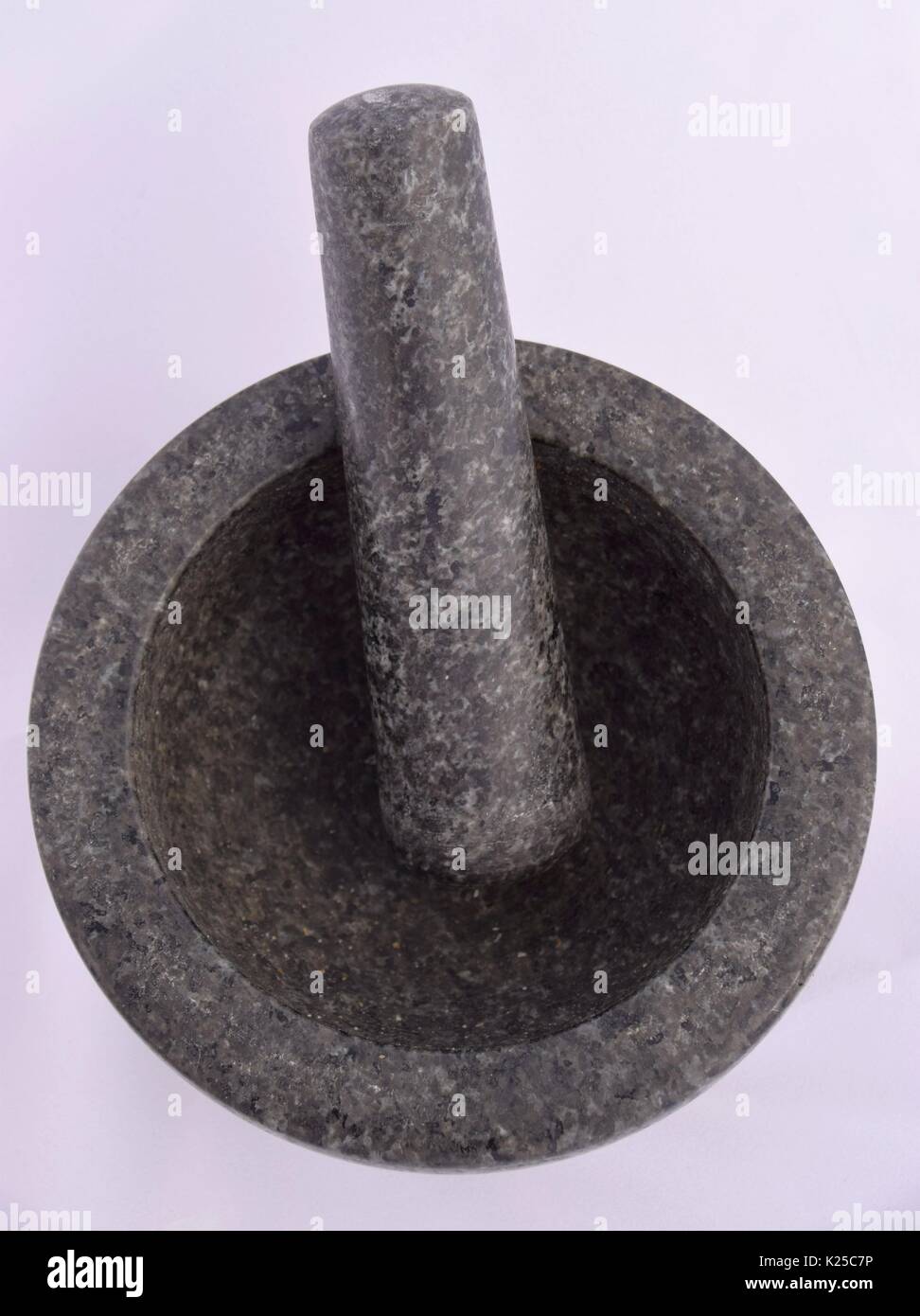 Mortar and pestle made of black marble or granite, grind the spices ...