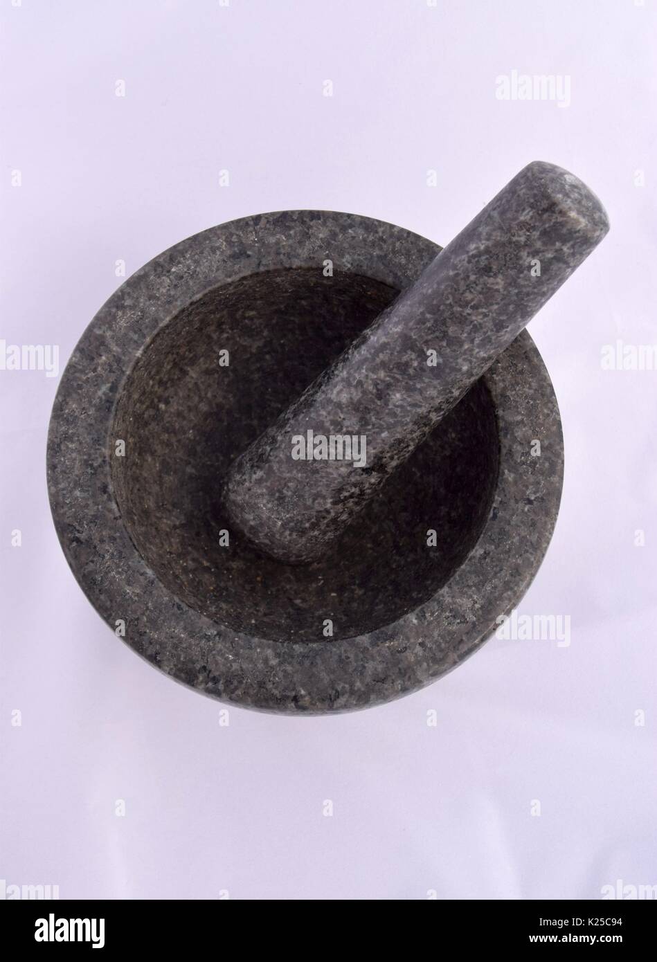 Mortar and pestle made of black marble or granite, grind the spices ...
