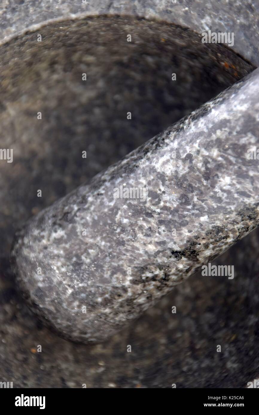 Mortar and pestle made of black marble or granite, grind the spices ...