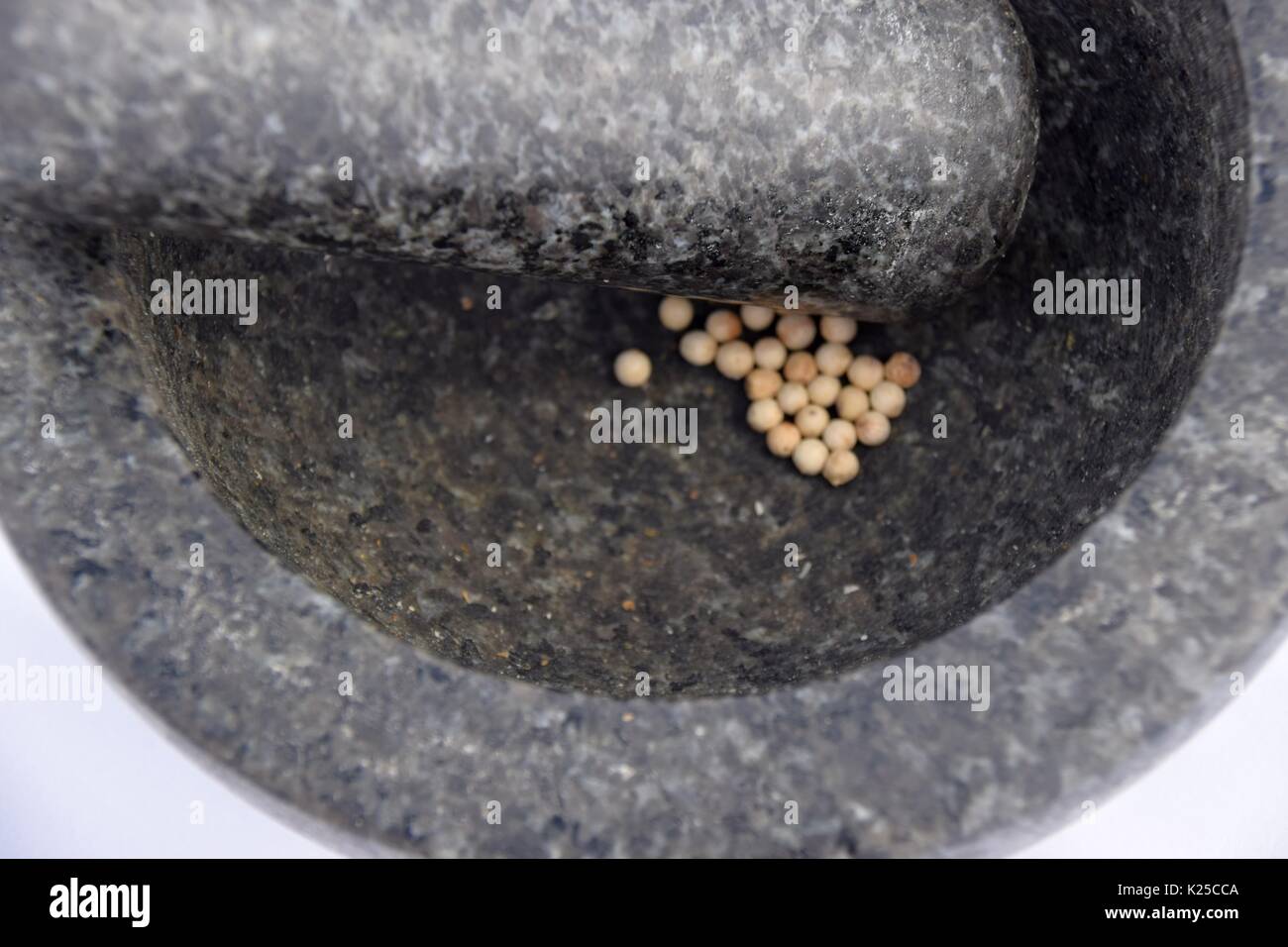 Mortar and pestle made of black marble or granite, grind the spices ...
