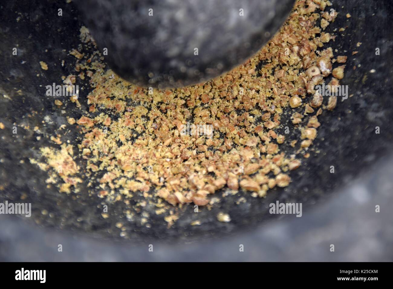 Mortar and pestle made of black marble or granite, grind the spices ...