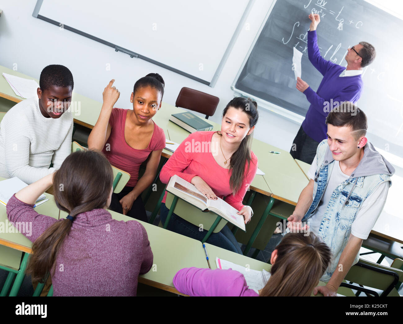 group of happy school pupils taking a rest together indoors Stock Photo ...