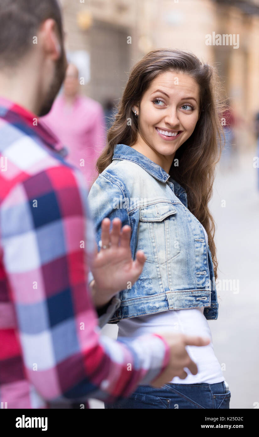 Attractive girl smiling back at nice-looking male stranger Stock Photo ...