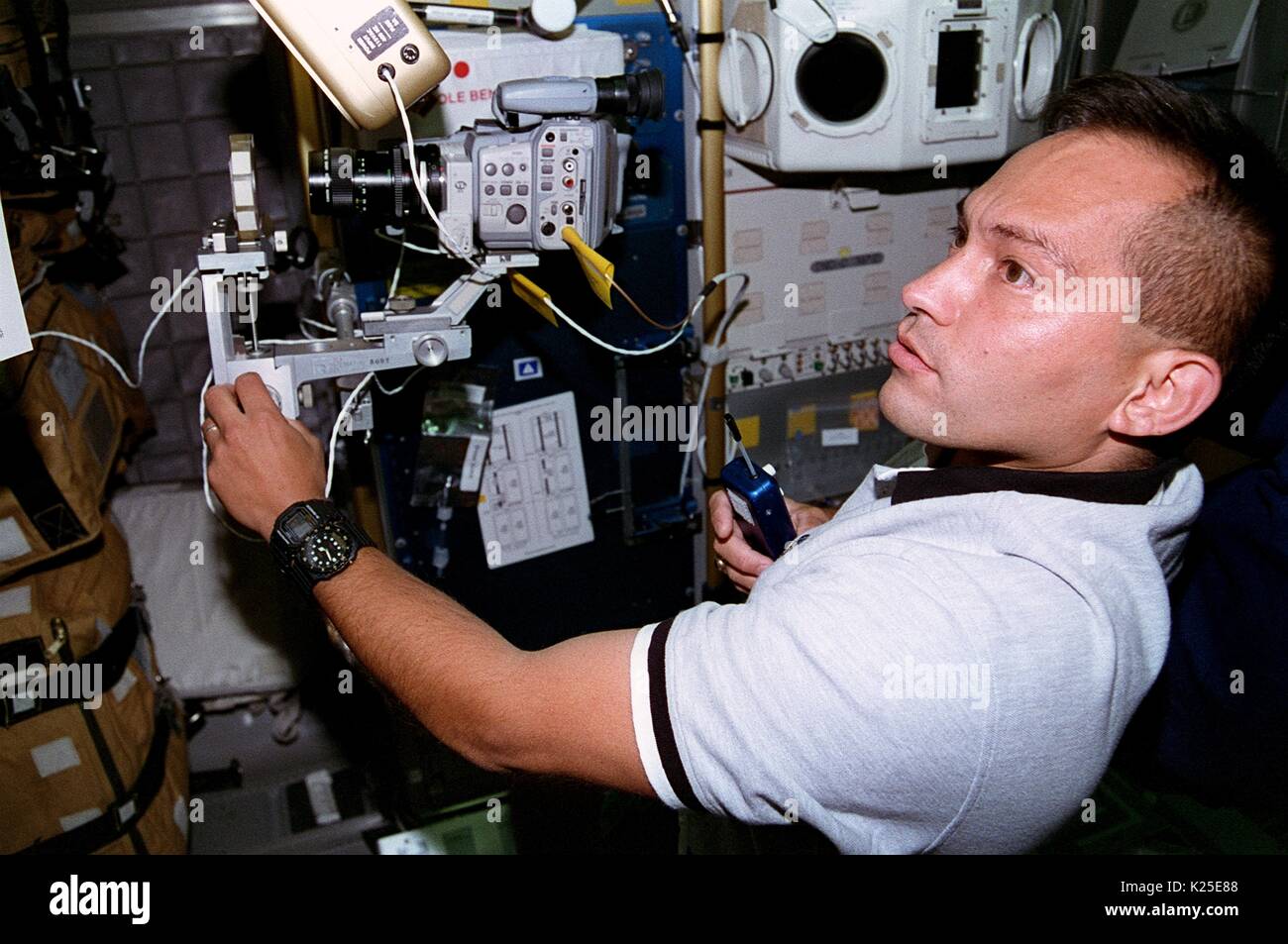 NASA Space Shuttle Atlantis STS-84 mission prime crew member astronaut Carlos Noriega works on ...