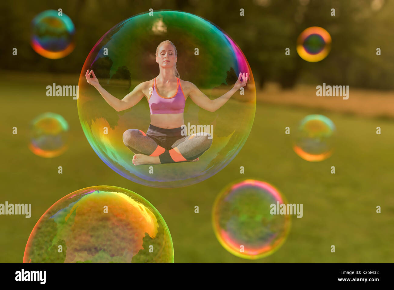 A yoga woman is hovering in a soap bubble Stock Photo - Alamy