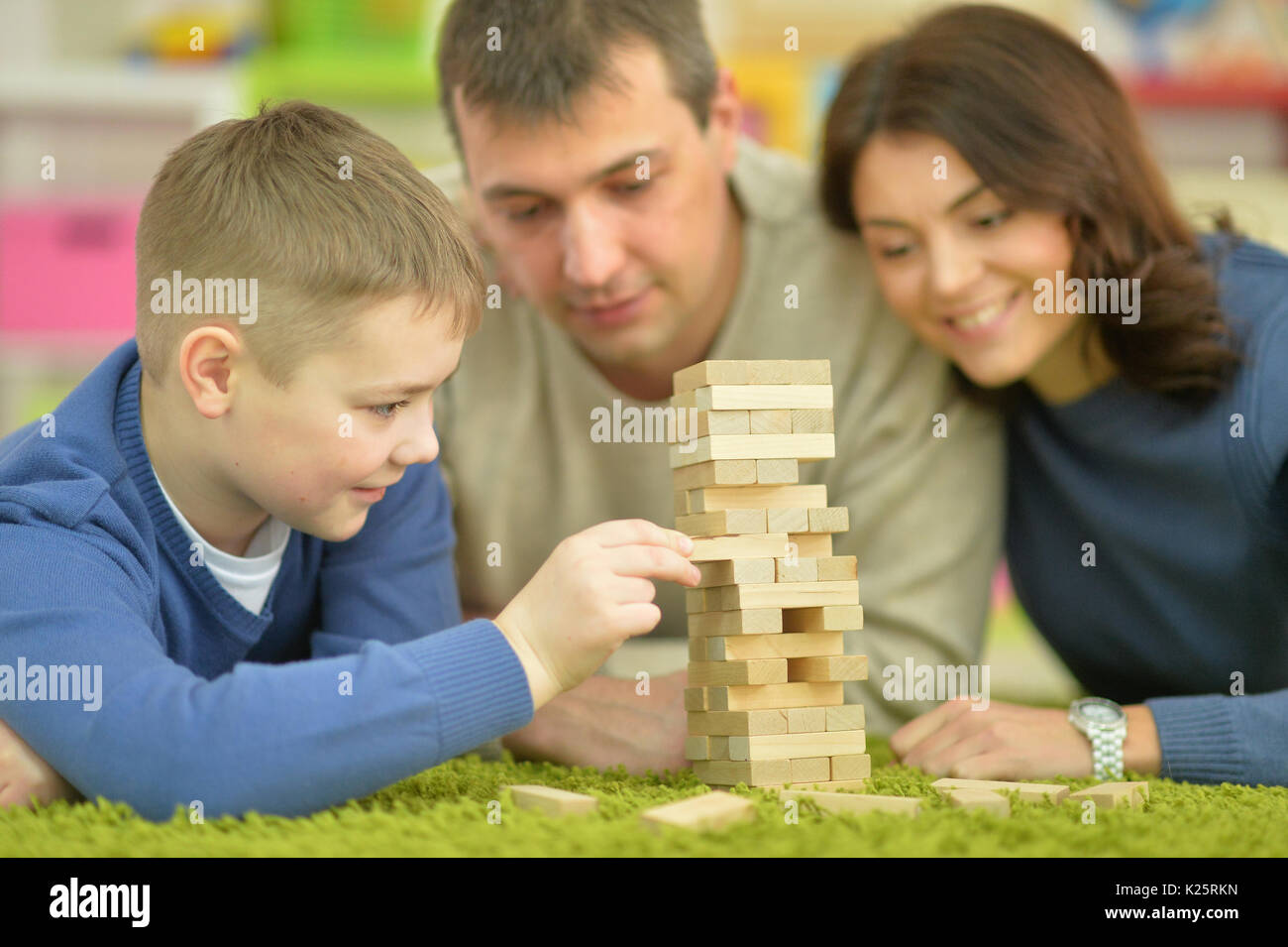 Boy playing with wooden blocks hi-res stock photography and images - Alamy