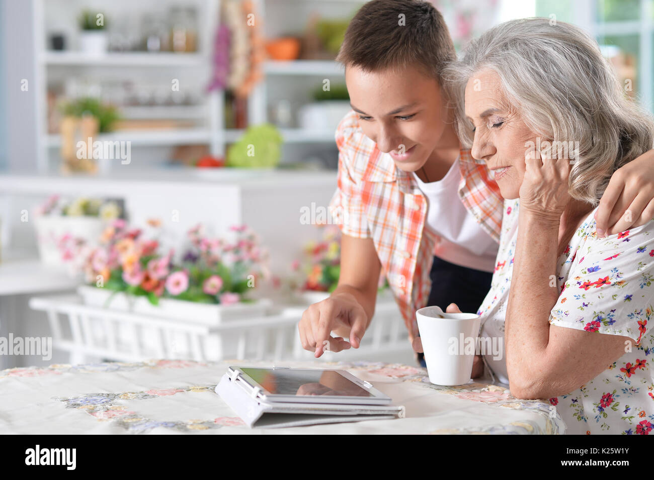 Grandmother teaching grandson hi-res stock photography and images - Alamy