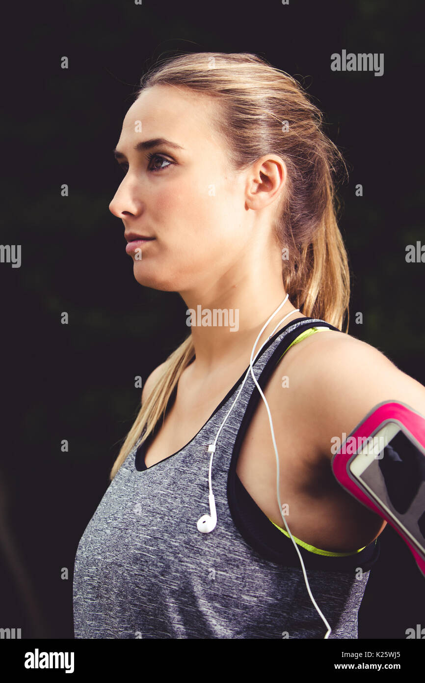 Beautiful mid adult woman takes a break while running outdoors Stock ...