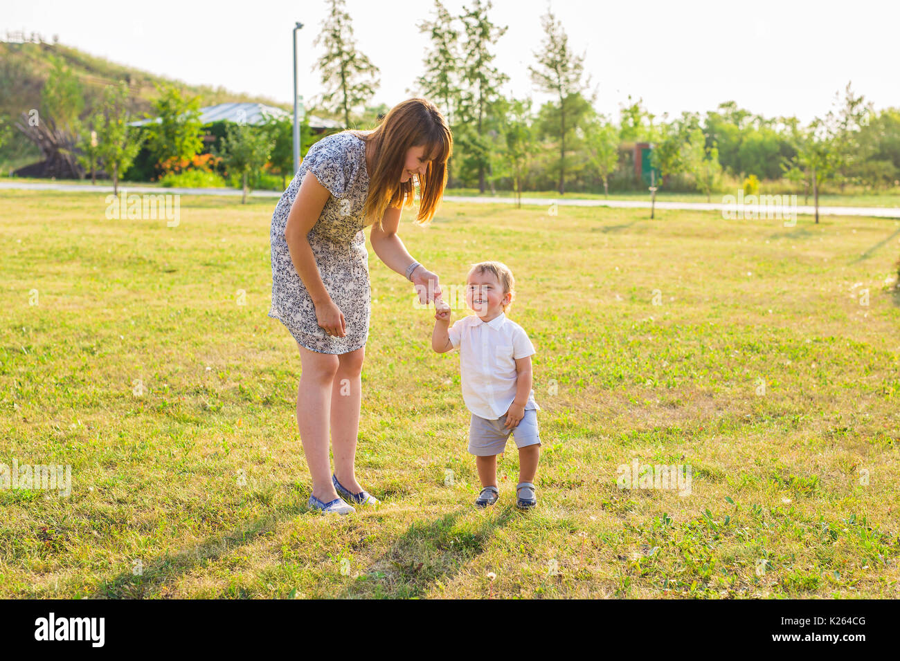 happy family having fun. baby boy and his mother playing outdoors Stock ...